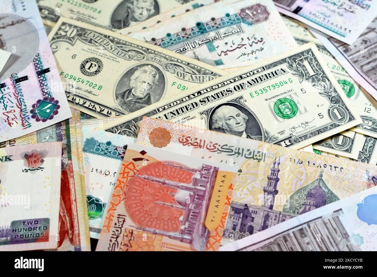 Pile of Egyptian and American money currency banknotes of 1, 2 and 20 ...