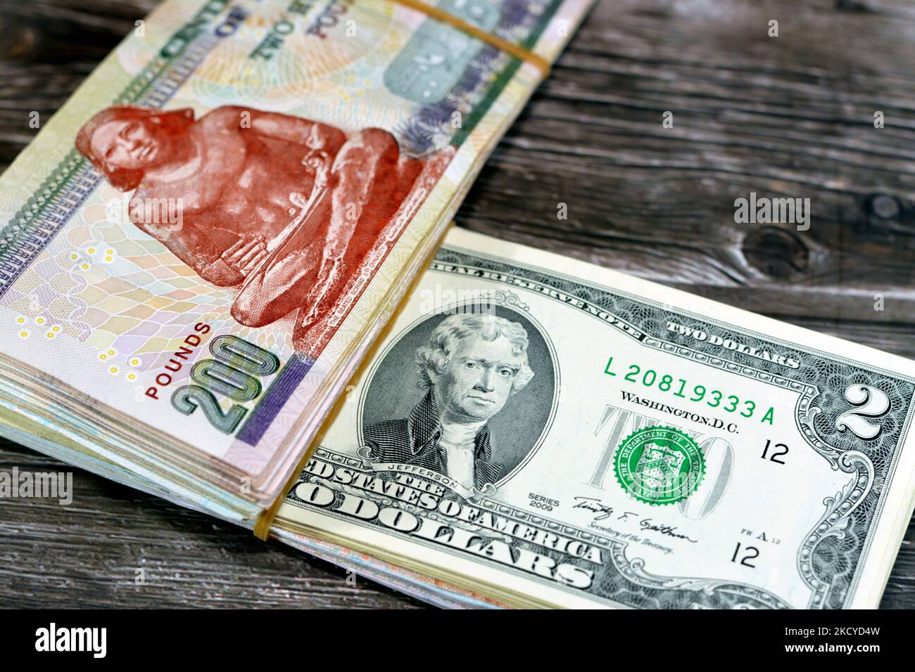 Stacks of Egyptian and American currency cash money banknotes with ...