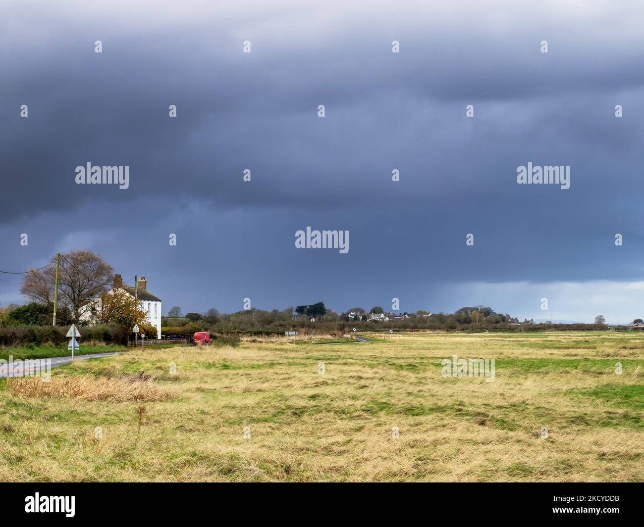 Dark rain clouds over Port Carlisle on the Solway estuary in Cumbria ...