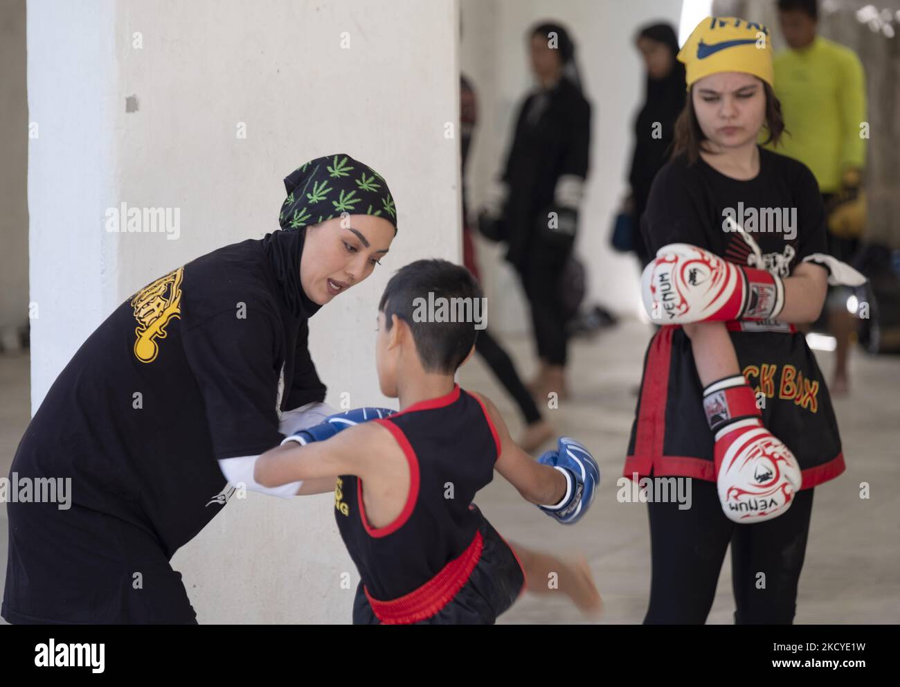 Afghan refugee woman, Masoumeh Najafi-26 (L) who is a kickboxing ...
