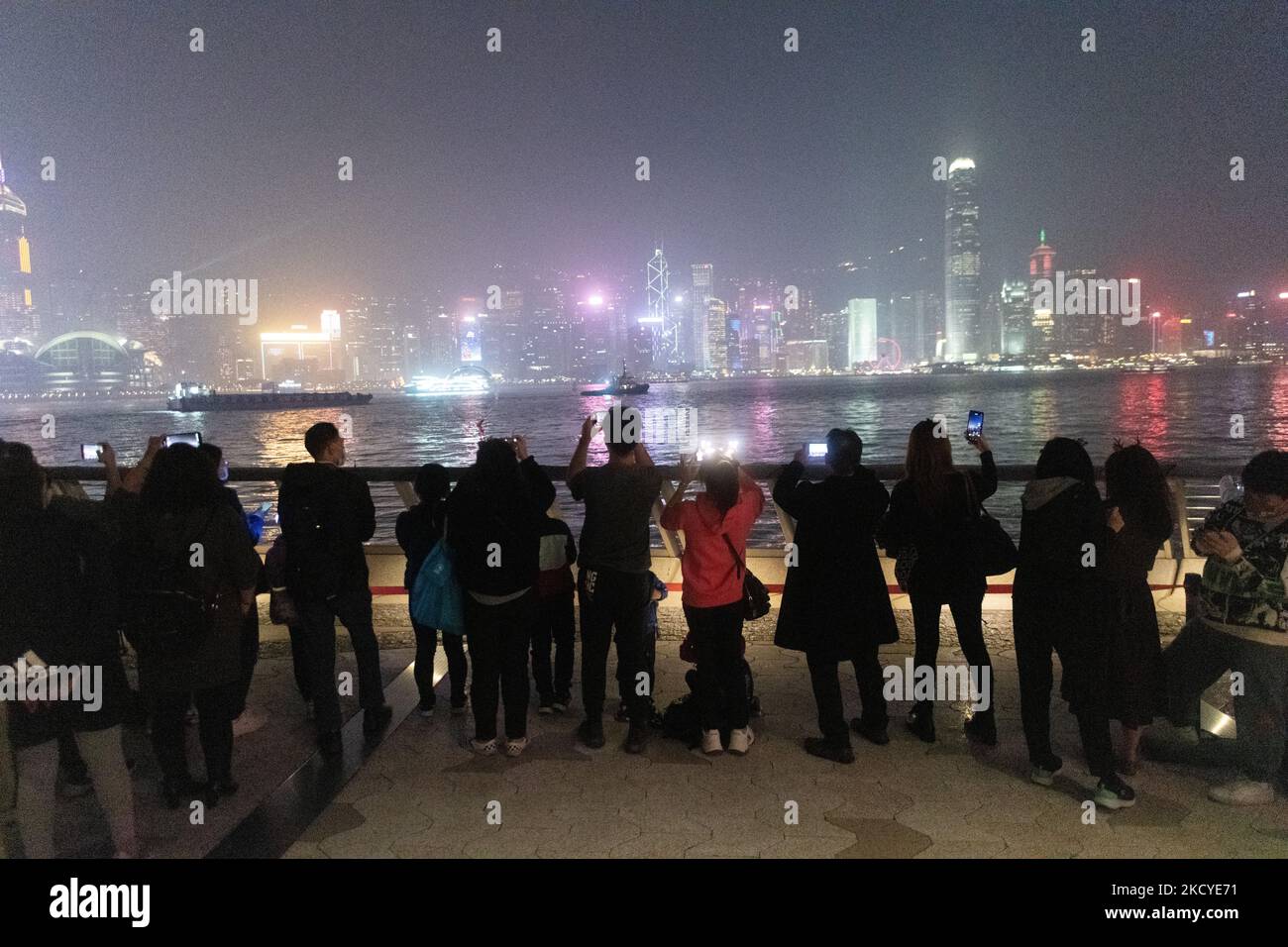 People film the Symphony of Lights on the Avenue of Stars on Christmas ...