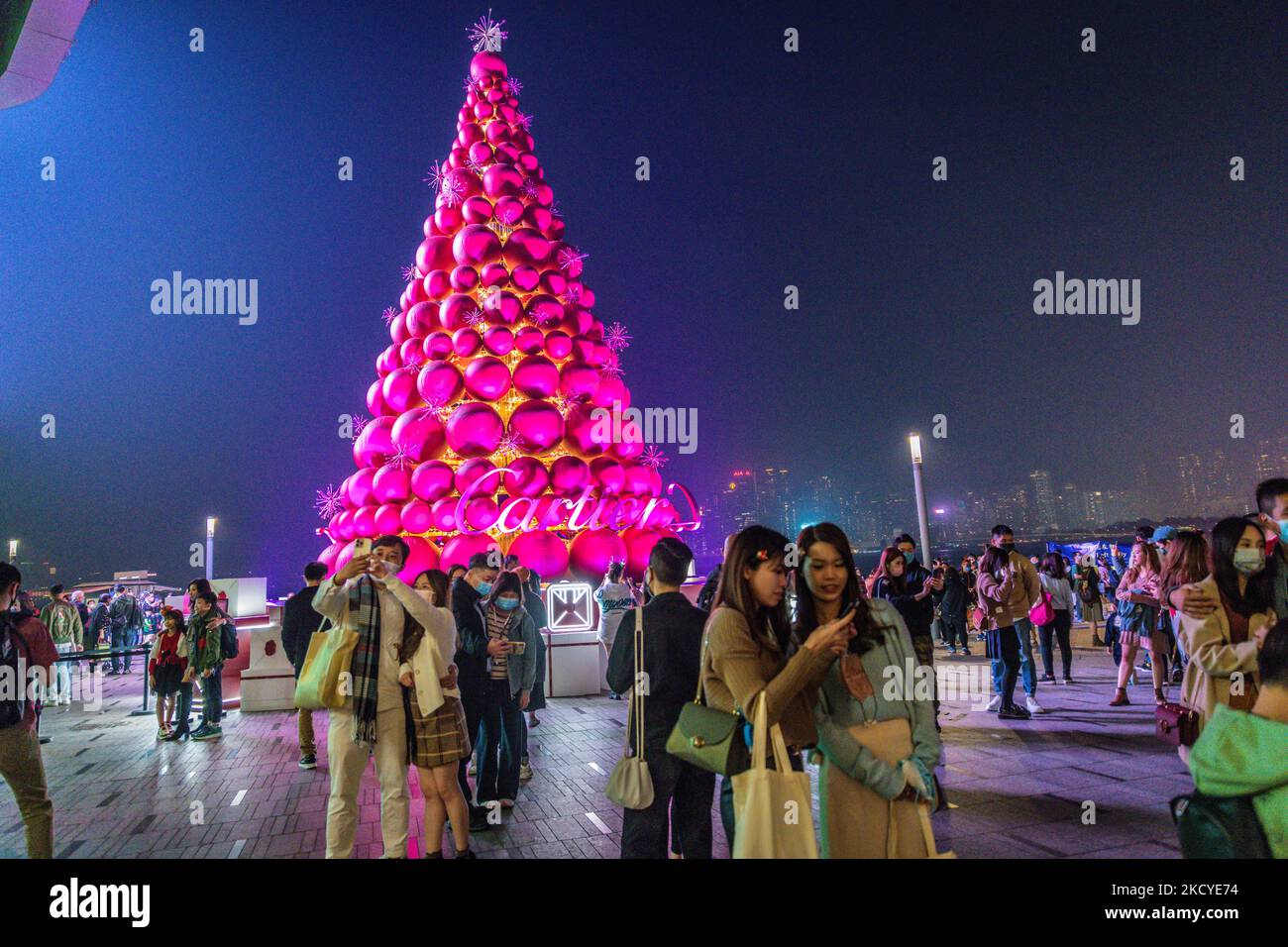 People take selfies before a Cartier Christmas tree in front of the K11 ...