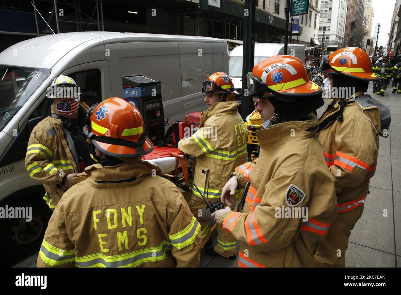 Emergency Medical Services (EMS) personnel standby for orders during a ...