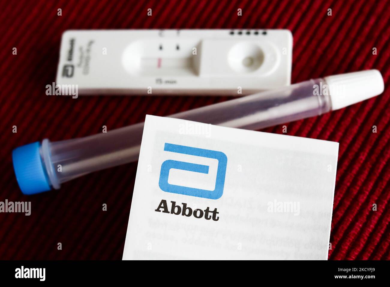 Abbott logo is seen with Abbott COVID-19 self-test kit in this ...