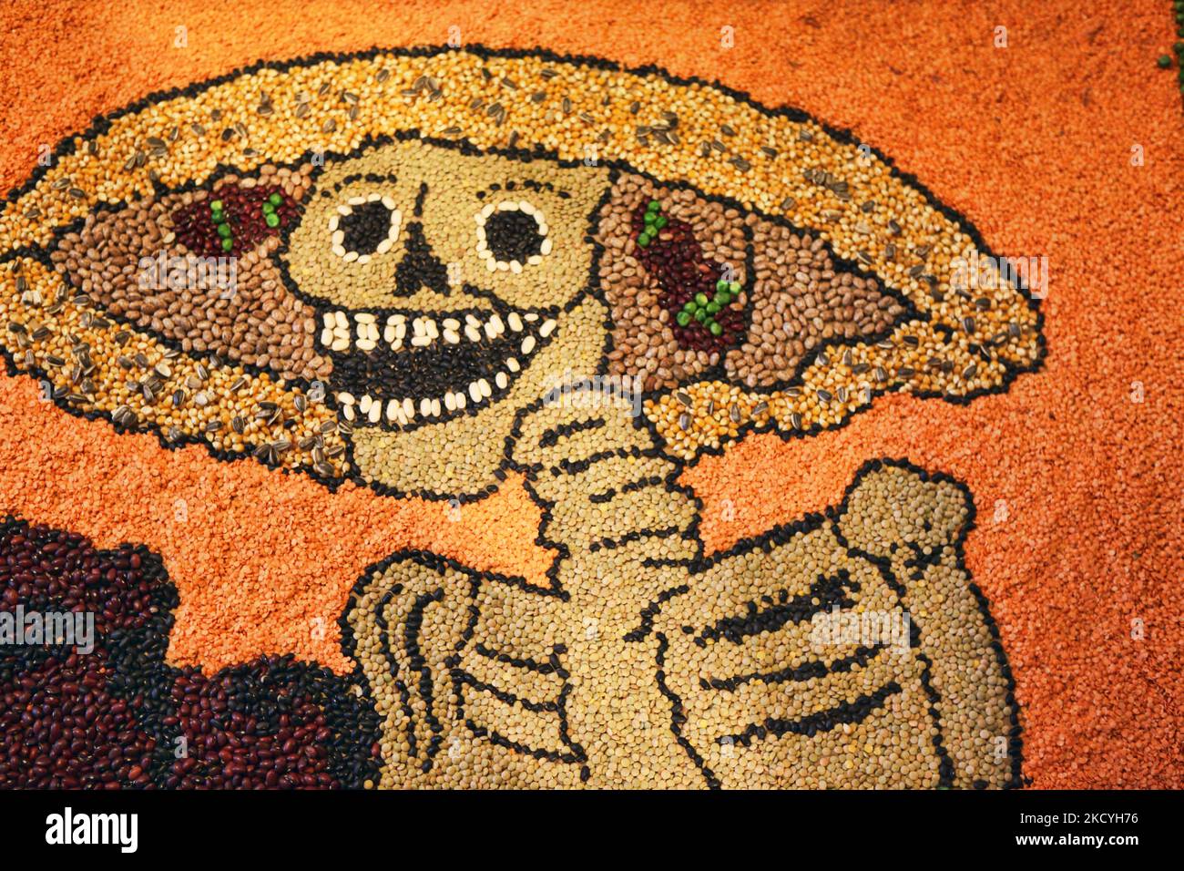 Skeleton figure created of various beans and lentils during the Day of ...