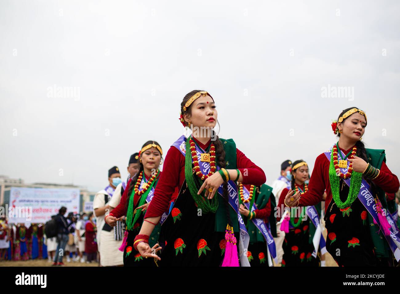 Nepalese people wearing traditional attire dance on the roads as they ...