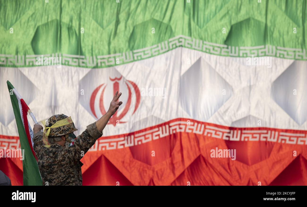 An Iranian man wearing a uniform of the Islamic Revolutionary Guard ...