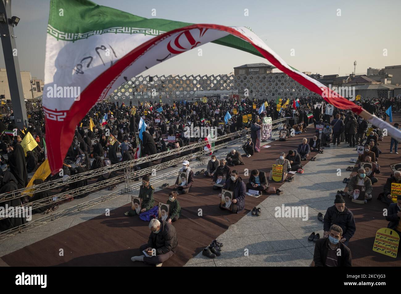 Iranian men hold portraits of Iran’s Supreme Leader Ayatollah Ali ...