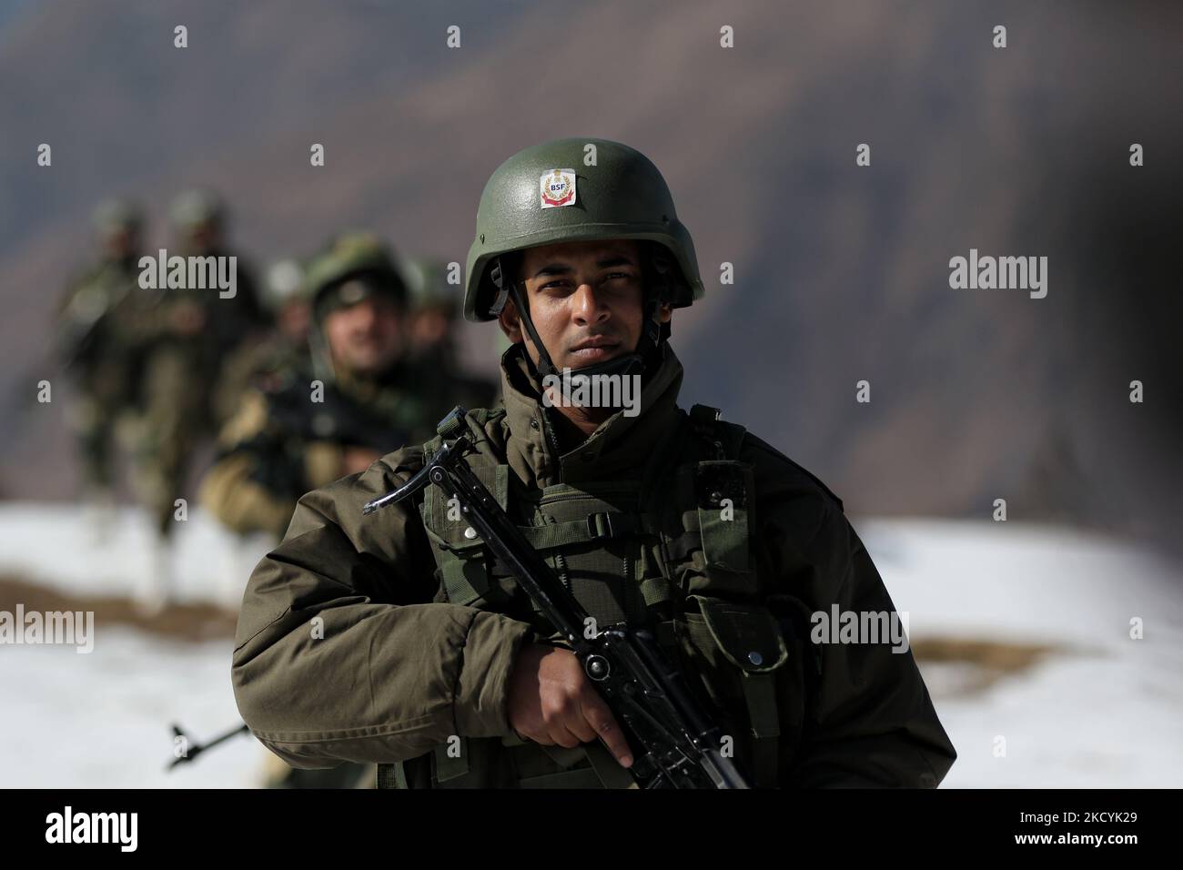 Border Security Force (BSF) soldiers stand alert at a forward post in ...