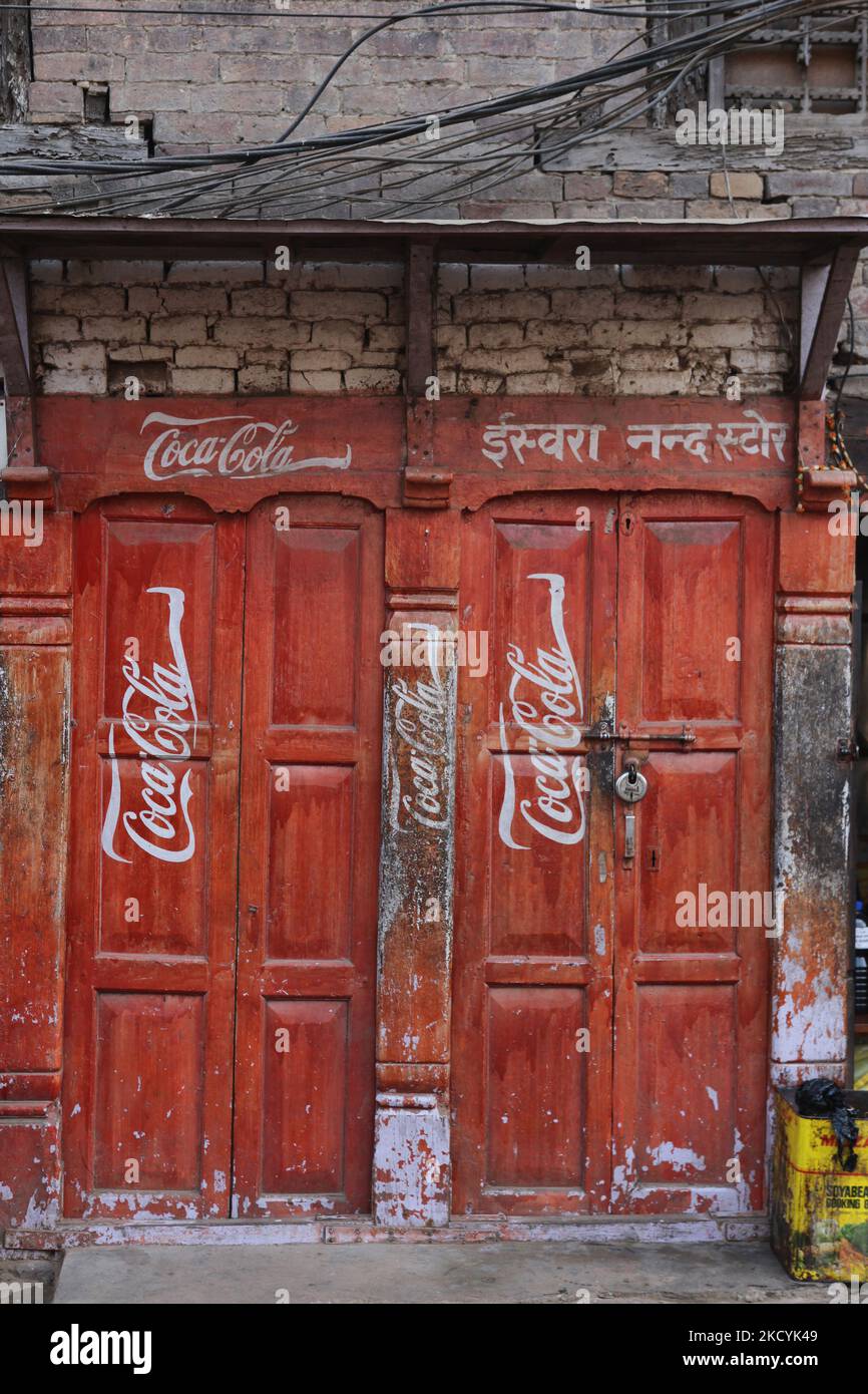 Coke advertisements painted on the doors of a shop in the ancient ...