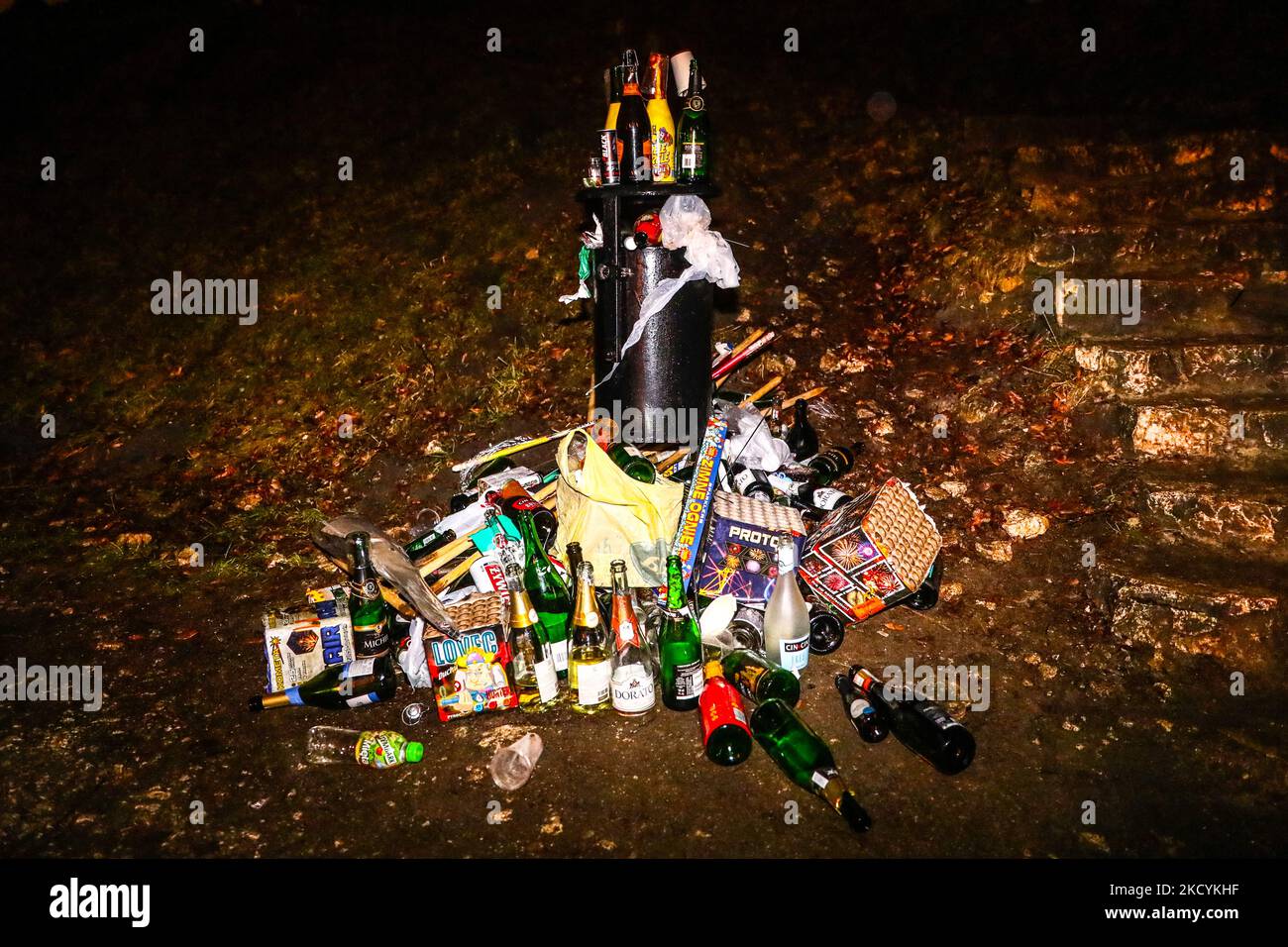 An overloaded trash bin after celebration of New Year at Krakus Mound ...