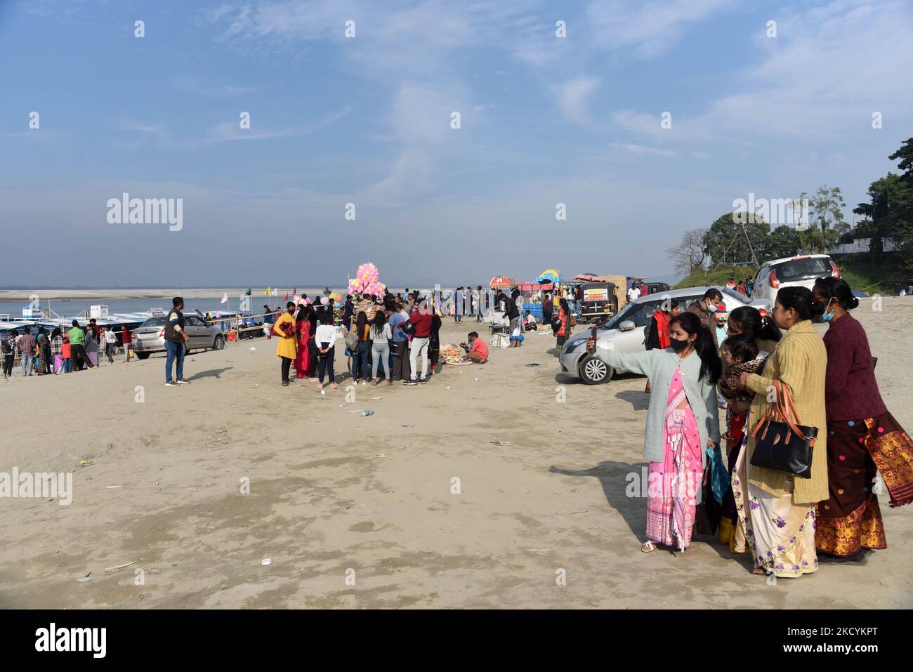 People arrives in the banks of Brahmaputra river to catch a ferry to ...