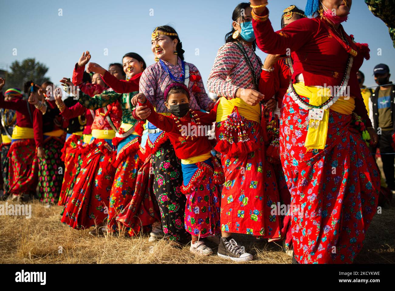People from the Kirat community wearing traditional attire dance during ...