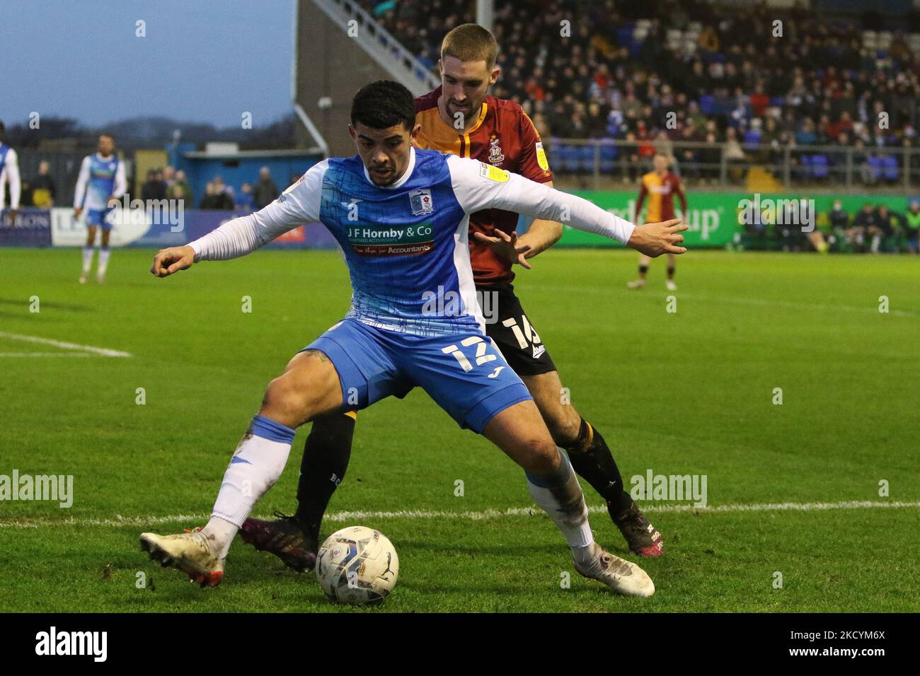 Josh Gordon of Barrow and Fiacre Kelleher of Bradford City in action ...