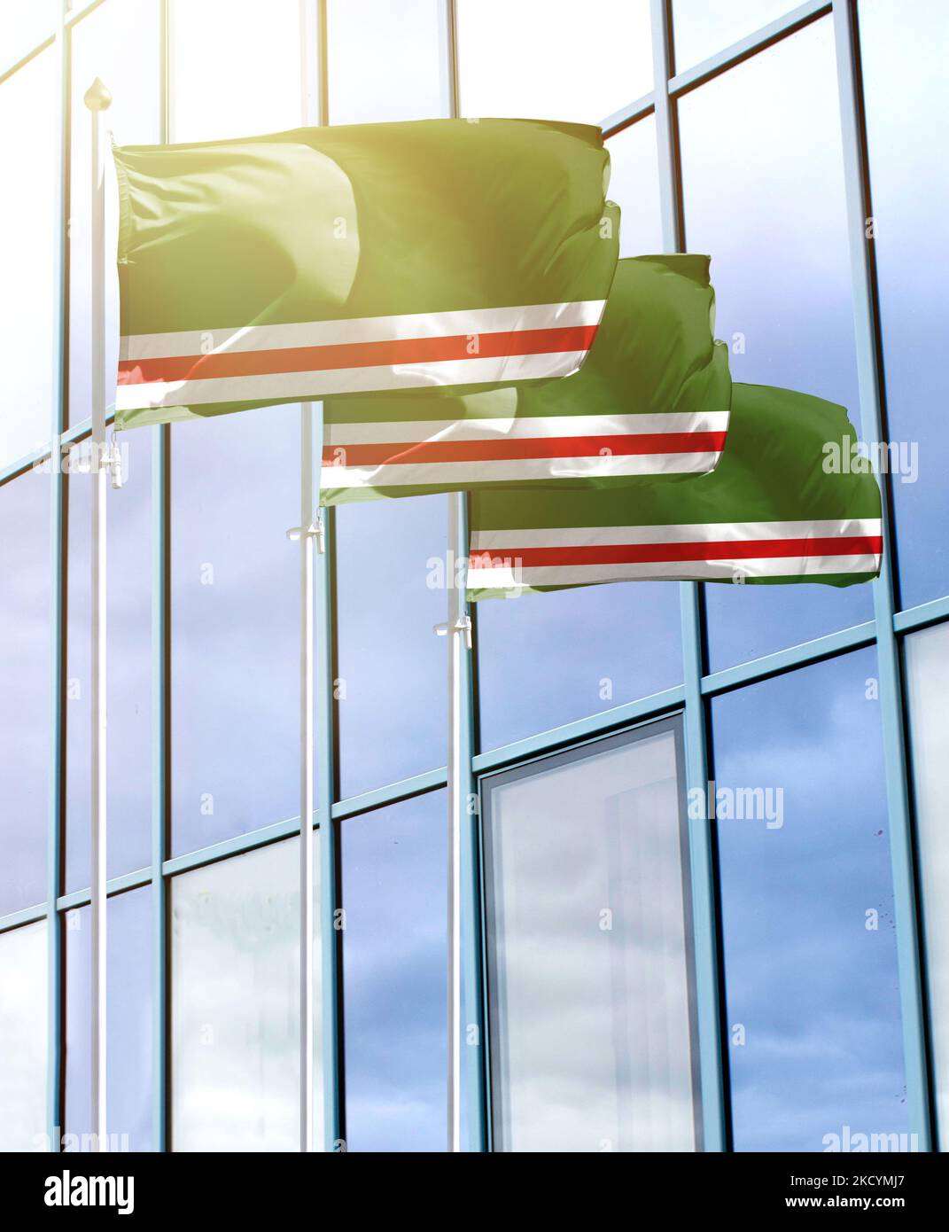 Flagpoles with the flag of Chechen Republic of Ichkeria in front of the ...