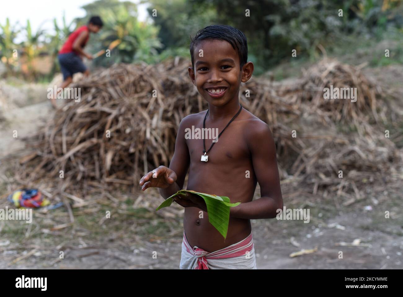 A boy eating Gur (jaggery) in a village on December 10, 2021 in Barpeta ...
