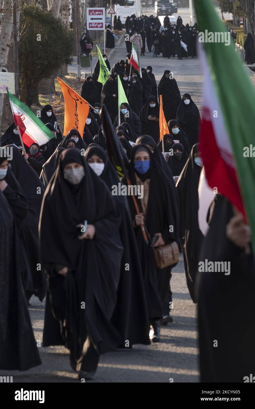 Iranian veiled women carrying Iran flags while arriving the Azadi ...