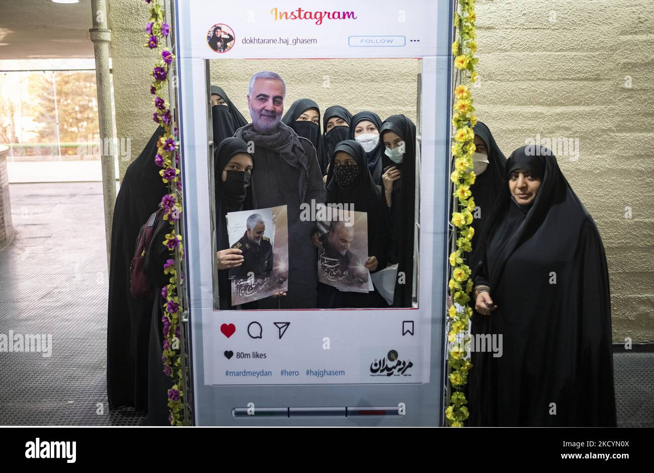 Iranian veiled women pose for photographs with an effigy of the Iranian ...