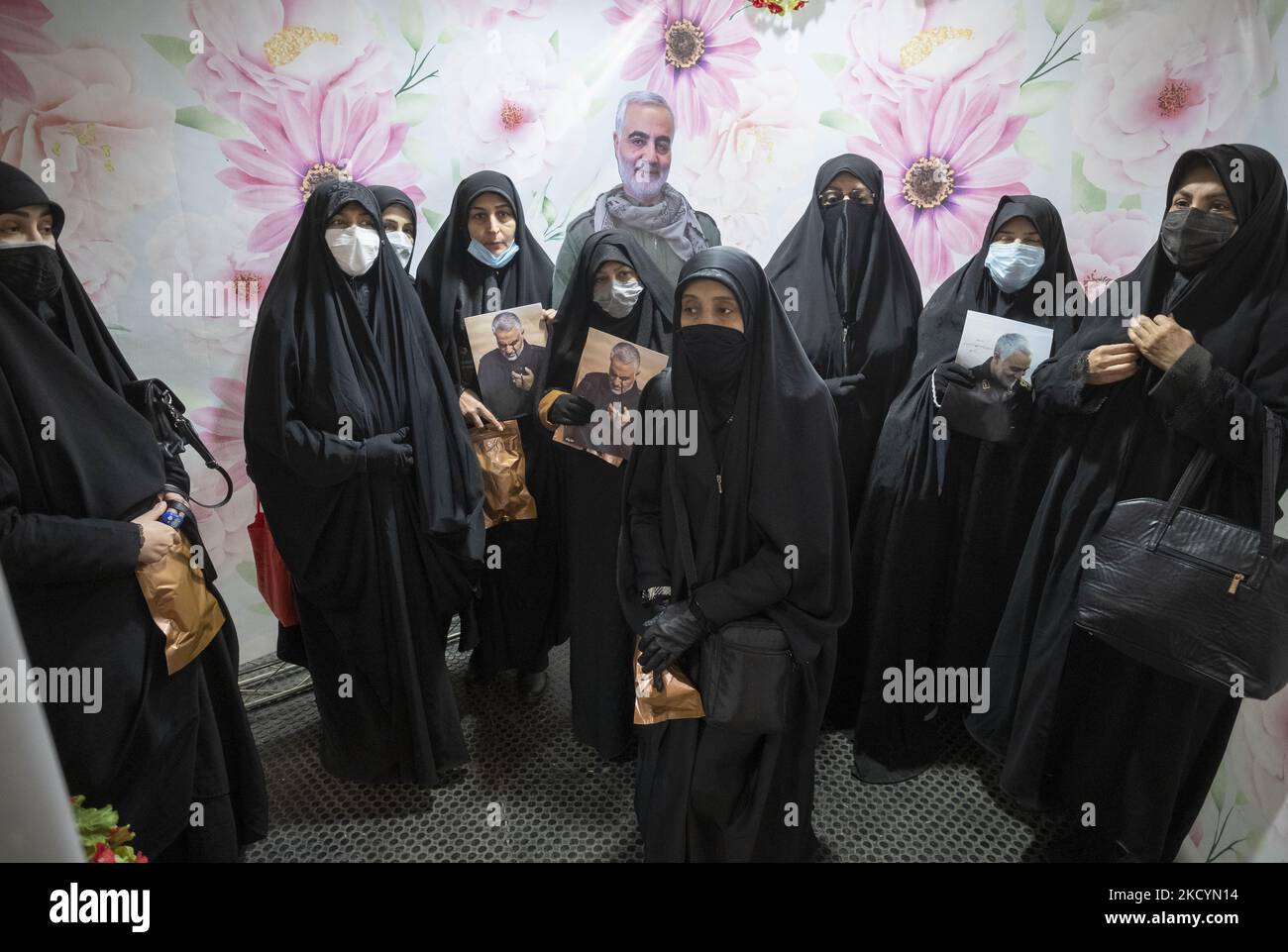 Iranian veiled women pose for photographs with an effigy of the Iranian ...