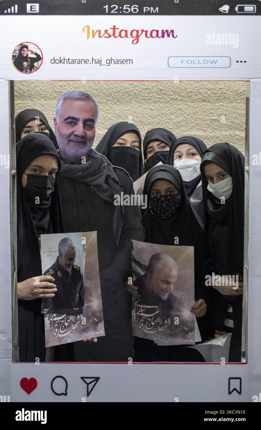 Iranian veiled women pose for photographs with an effigy of the Iranian ...