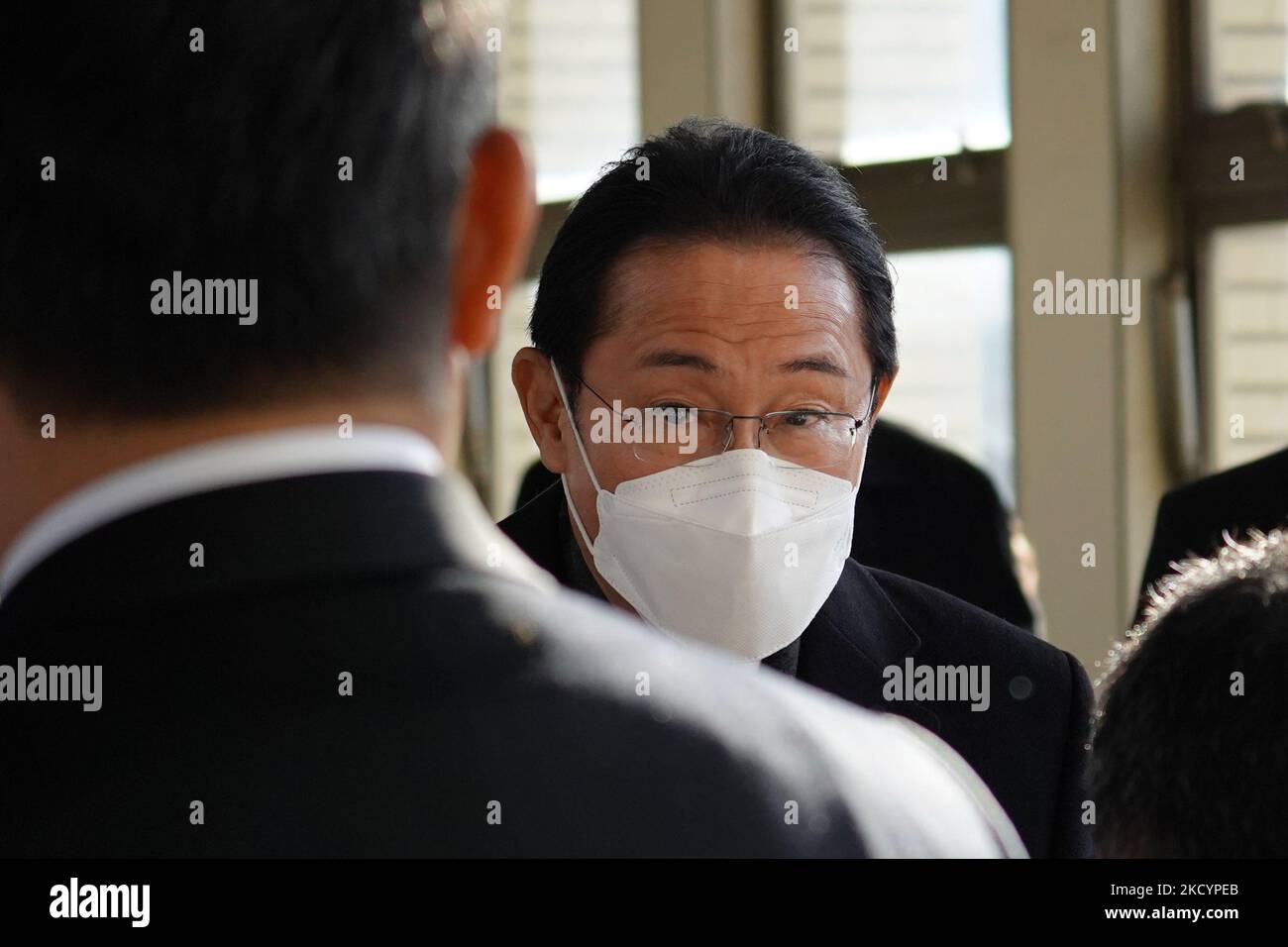 Japan’s Prime Minister Fumio Kishida wearing a face mask arrives at ...