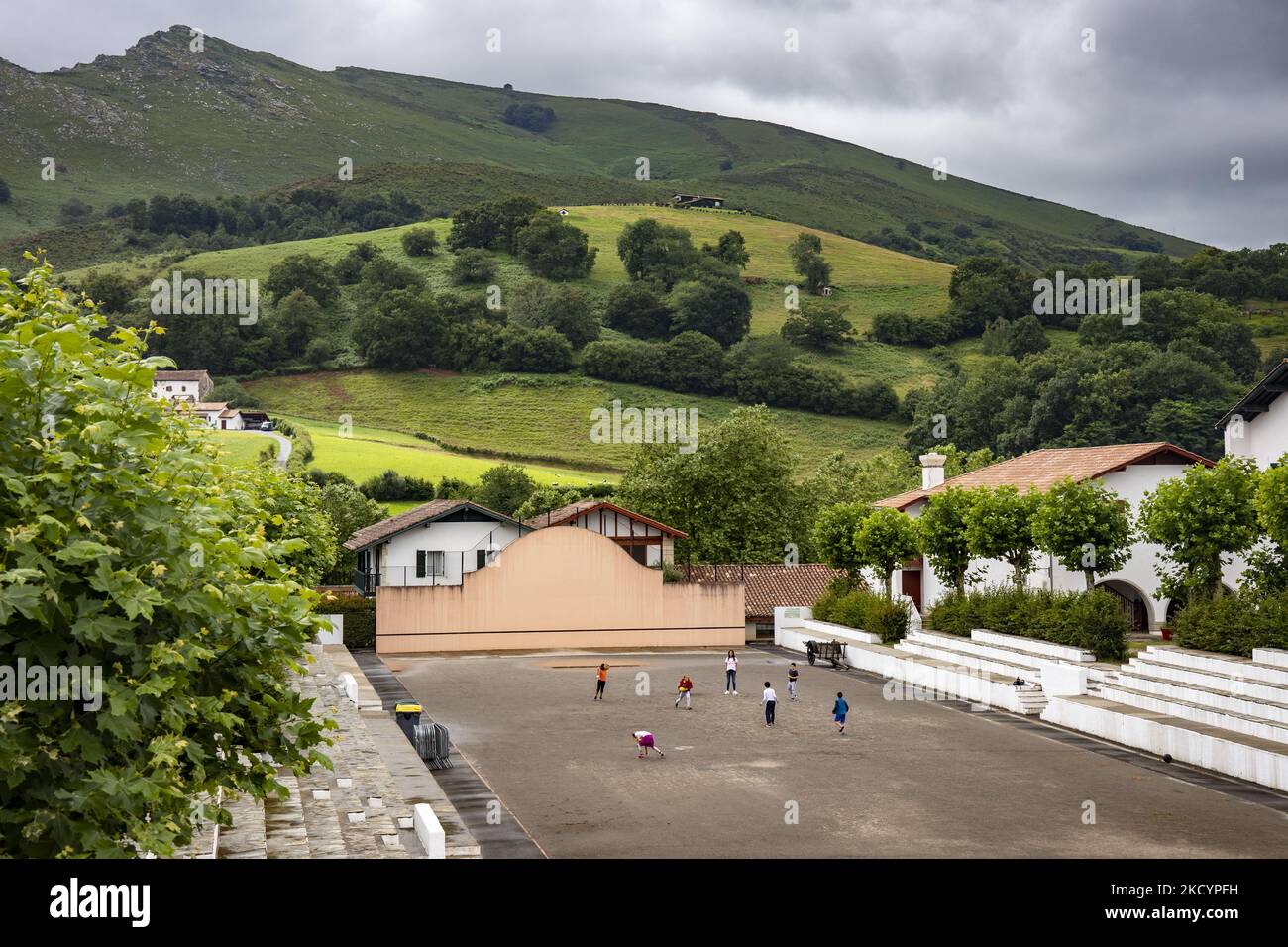 Children play in the arena for the game Basque pelota in Sare, in the ...