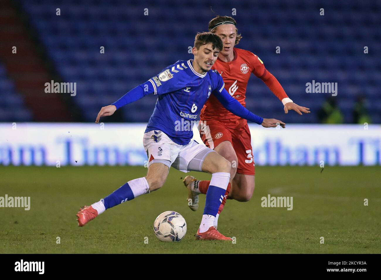 Oldham Athletic's Jamie Bowden tussles with Thelo Aasgaard of Wigan ...