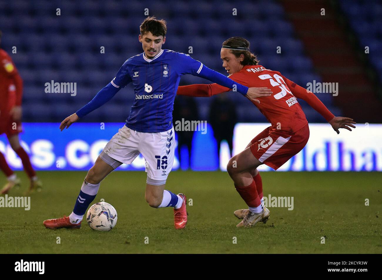 Oldham Athletic's Jamie Bowden tussles with Thelo Aasgaard of Wigan ...