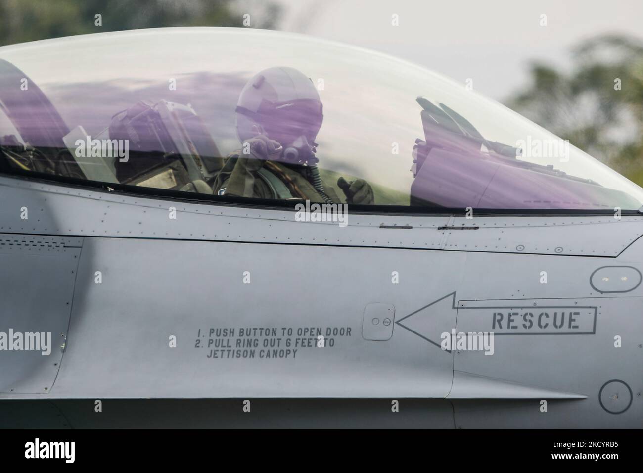 A pilot is seen inside a cockpit of an F-16V jet fighter taxies on the ...