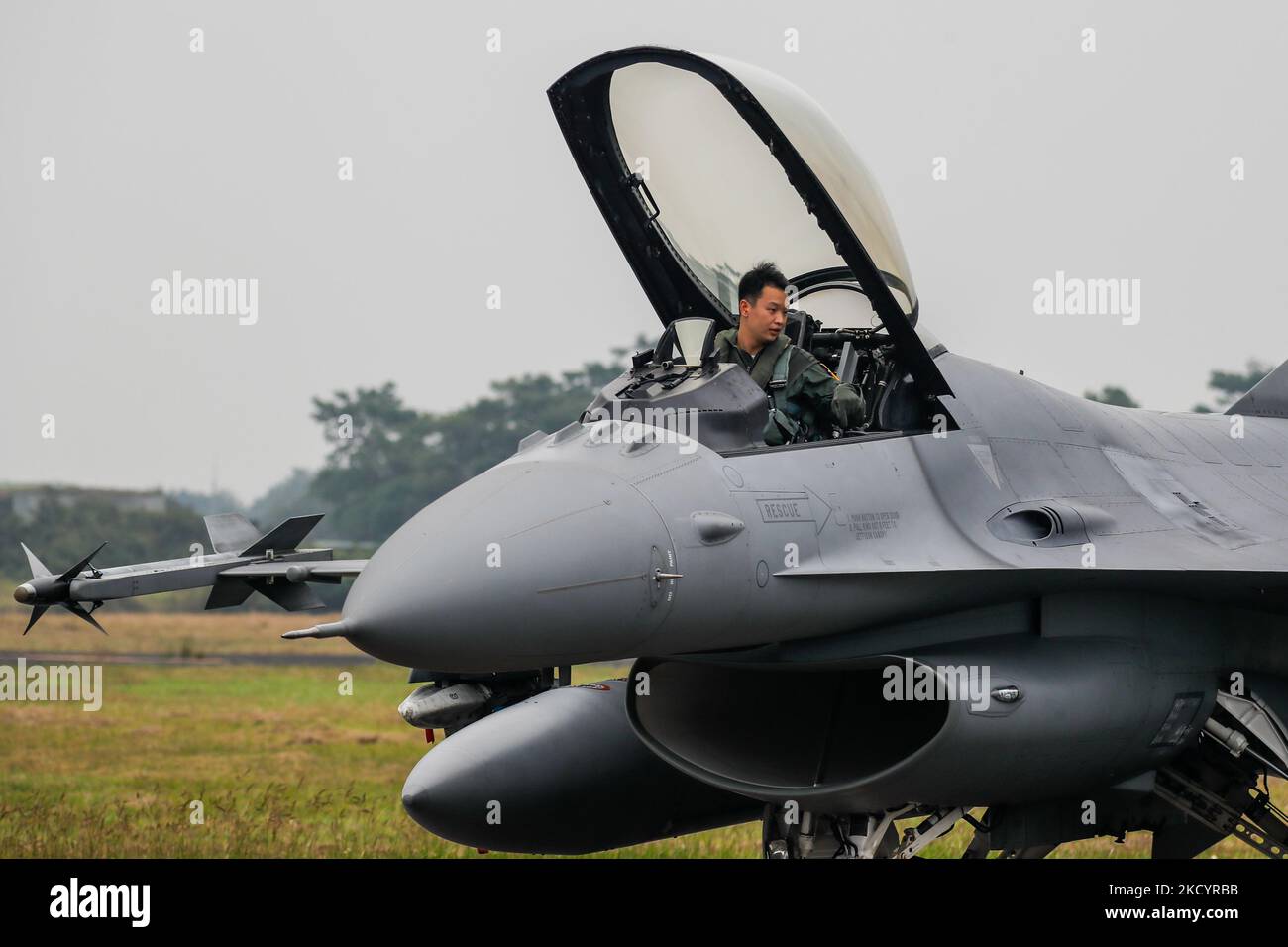 A pilot is seen inside a cockpit of an F-16V jet fighter taxies on the ...