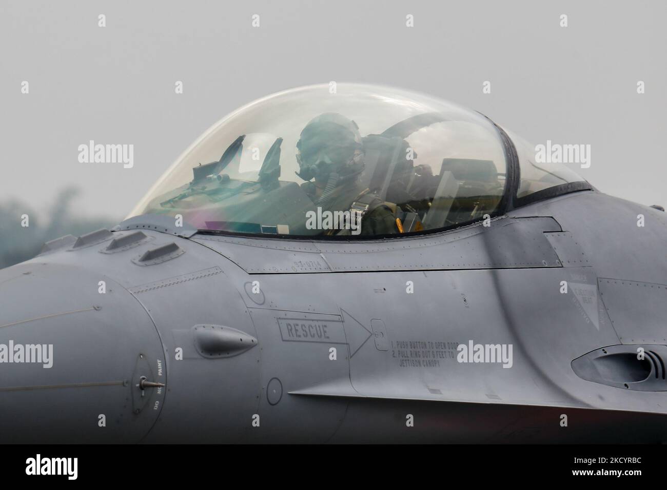 A pilot is seen inside a cockpit of an F-16V jet fighter taxies on the ...
