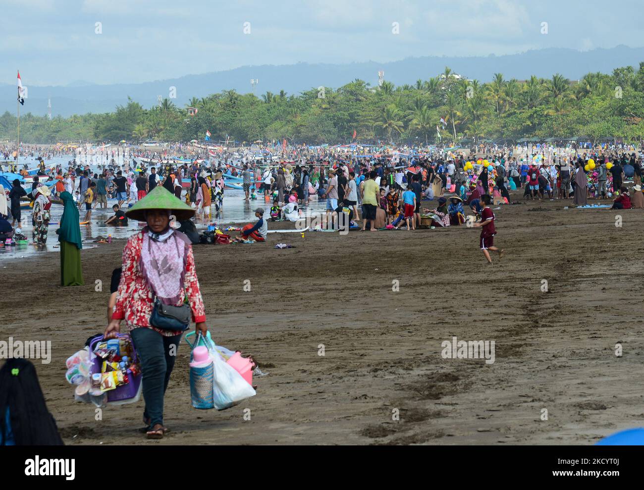 People enjoy during holiday in Pangandaran beach in West Java ...