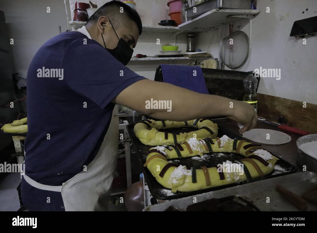 A baker decorates Roscas de Reyes at a bakery in Iztapalapa, Mexico ...
