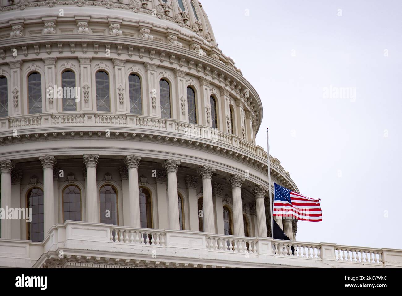 Flags are flown at halfstaff on the U.S. Capitol building on January 6 ...