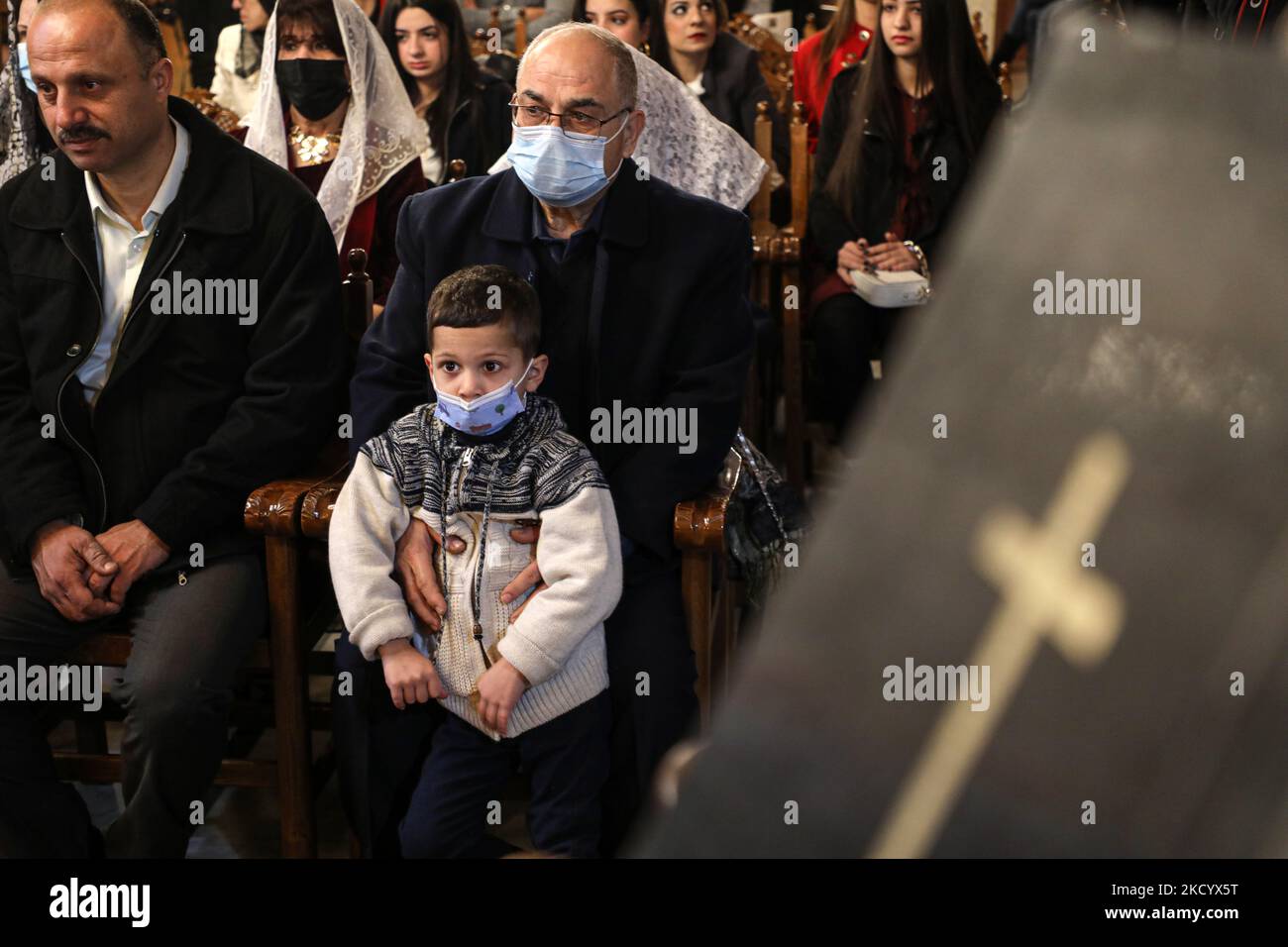 Palestinian Orthodox Christians pray during Christmas Eve Mass at St ...