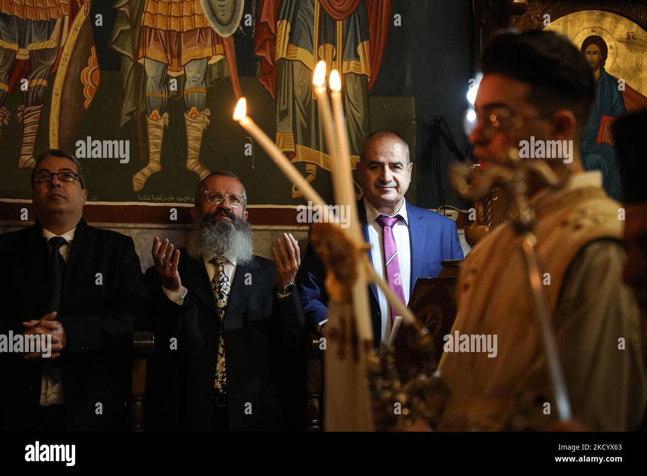 Palestinian Orthodox Christians pray during Christmas Eve Mass at St ...