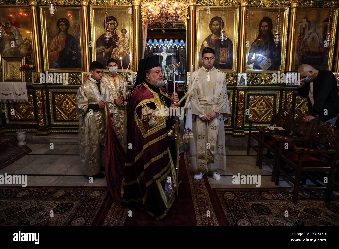Palestinian Orthodox Christians pray during Christmas Eve Mass at St ...