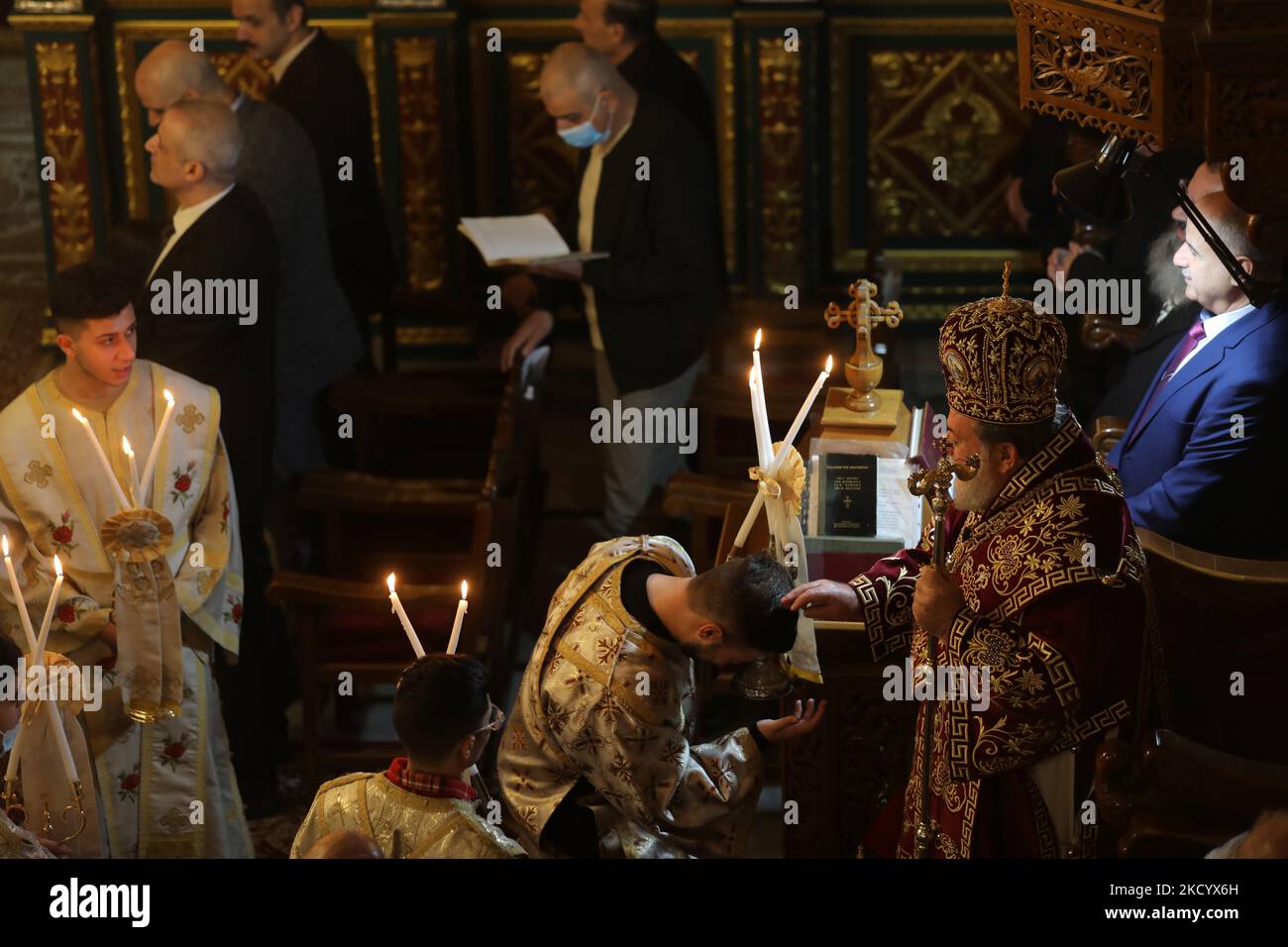 Palestinian Orthodox Christians pray during Christmas Eve Mass at St ...