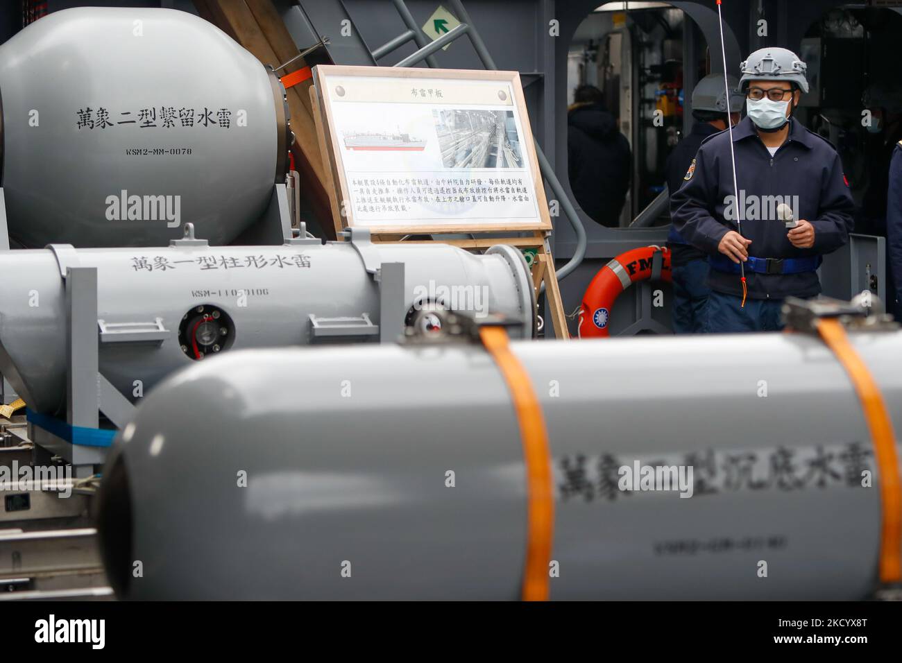 Navy soldiers are seen next to the mines on a Taiwanese military ...