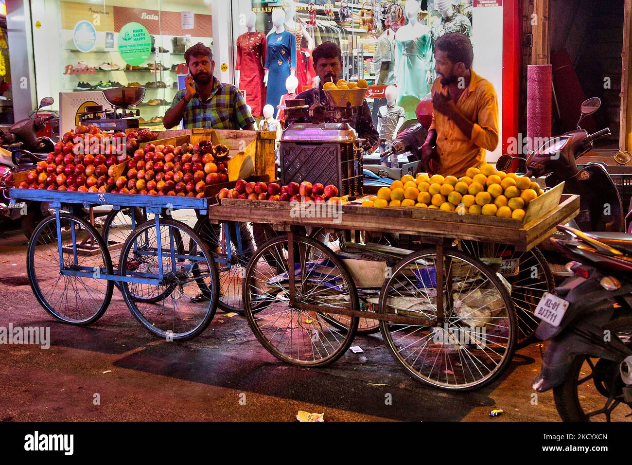Men selling fruit along a crowded street in the East Fort area of the ...