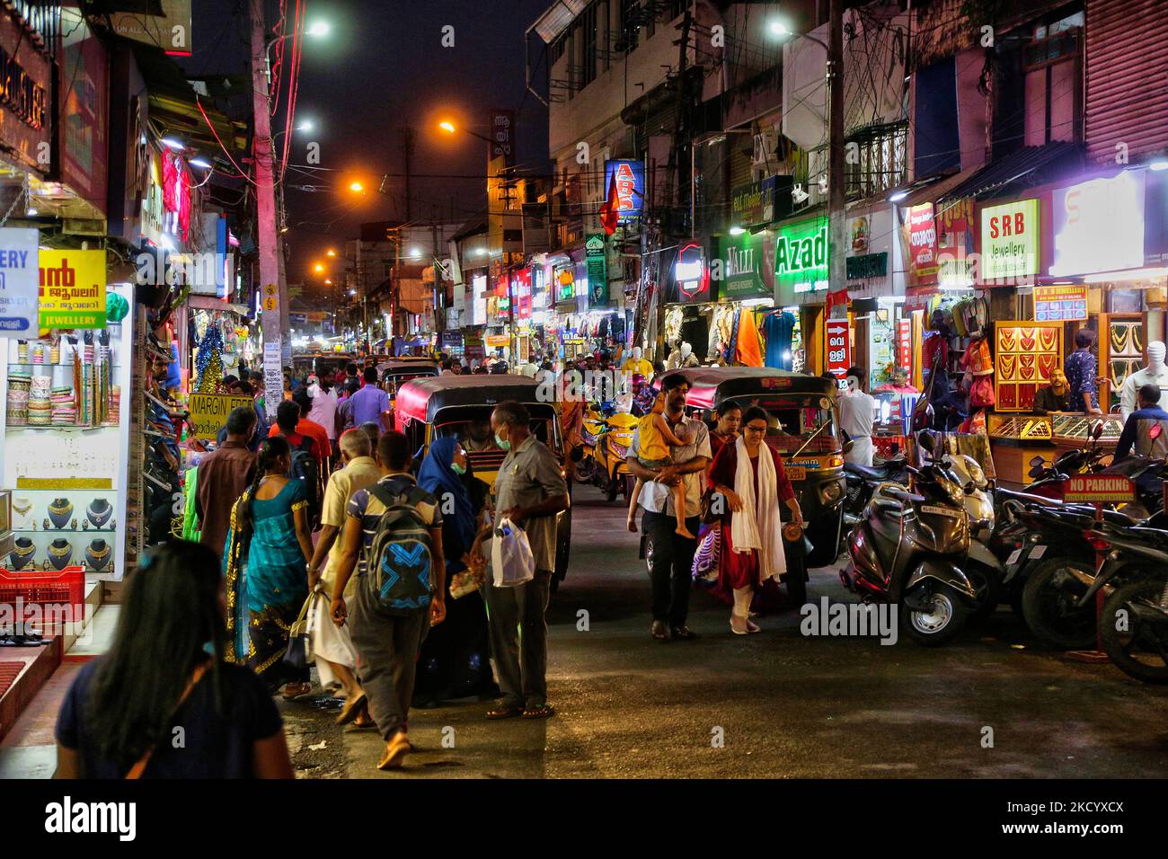 Crowded street lined with shops in the East Fort area of the city of ...