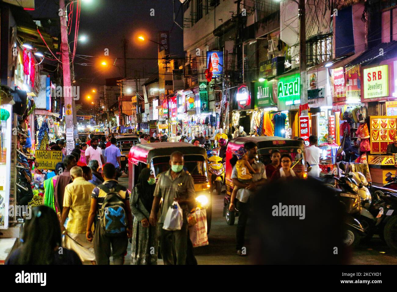 Crowded street lined with shops in the East Fort area of the city of ...