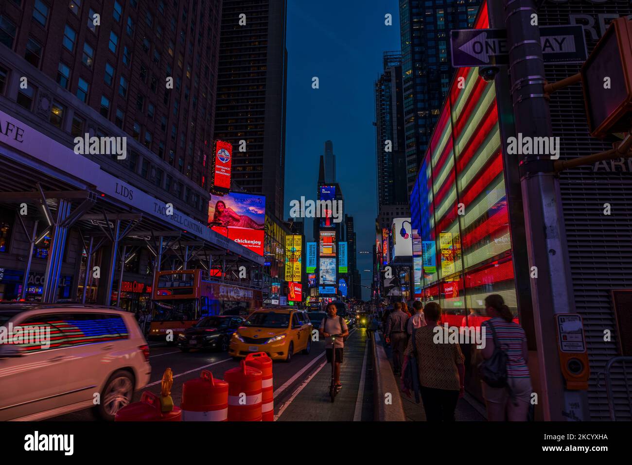 Beautiful view of night Broadway with skyscrapers, cars and people ...