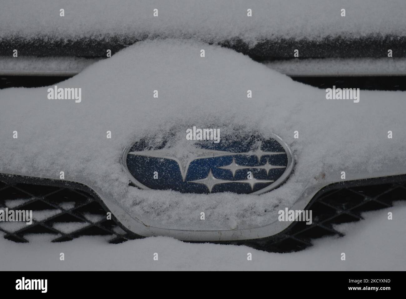 Subaru logo seen on a Subaru car covered with snow in downtown Edmonton ...