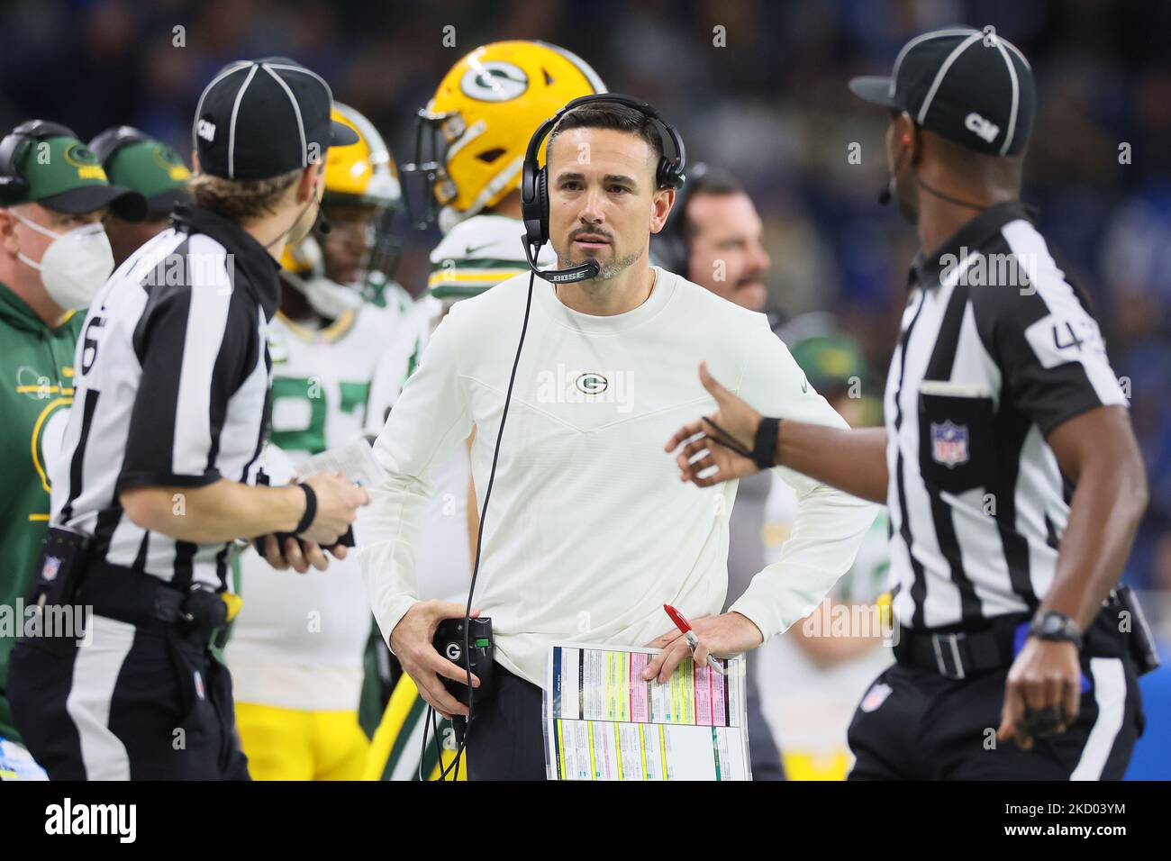 Line judge Walt Coleman IV (65) and field judge Nate Jones (42) talk ...