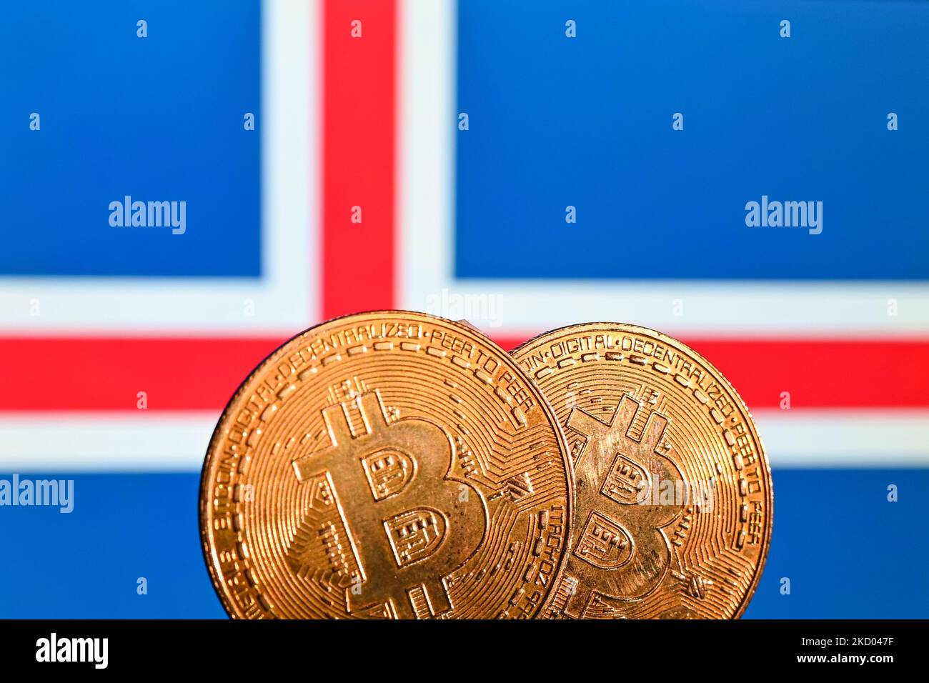Illustrative image of two commemorative bitcoins seen in front of the ...