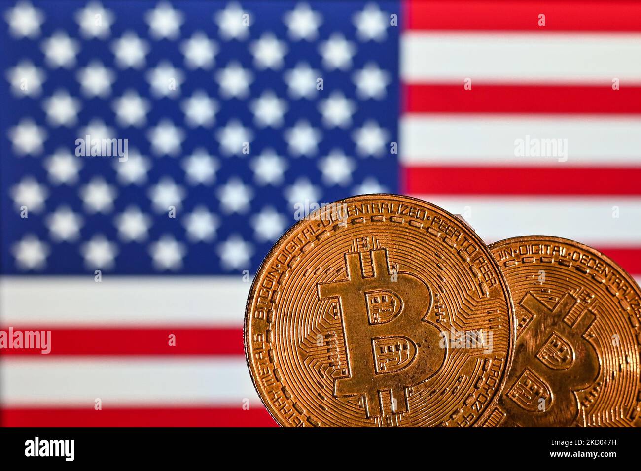 Illustrative image of two commemorative bitcoins seen in front of the ...