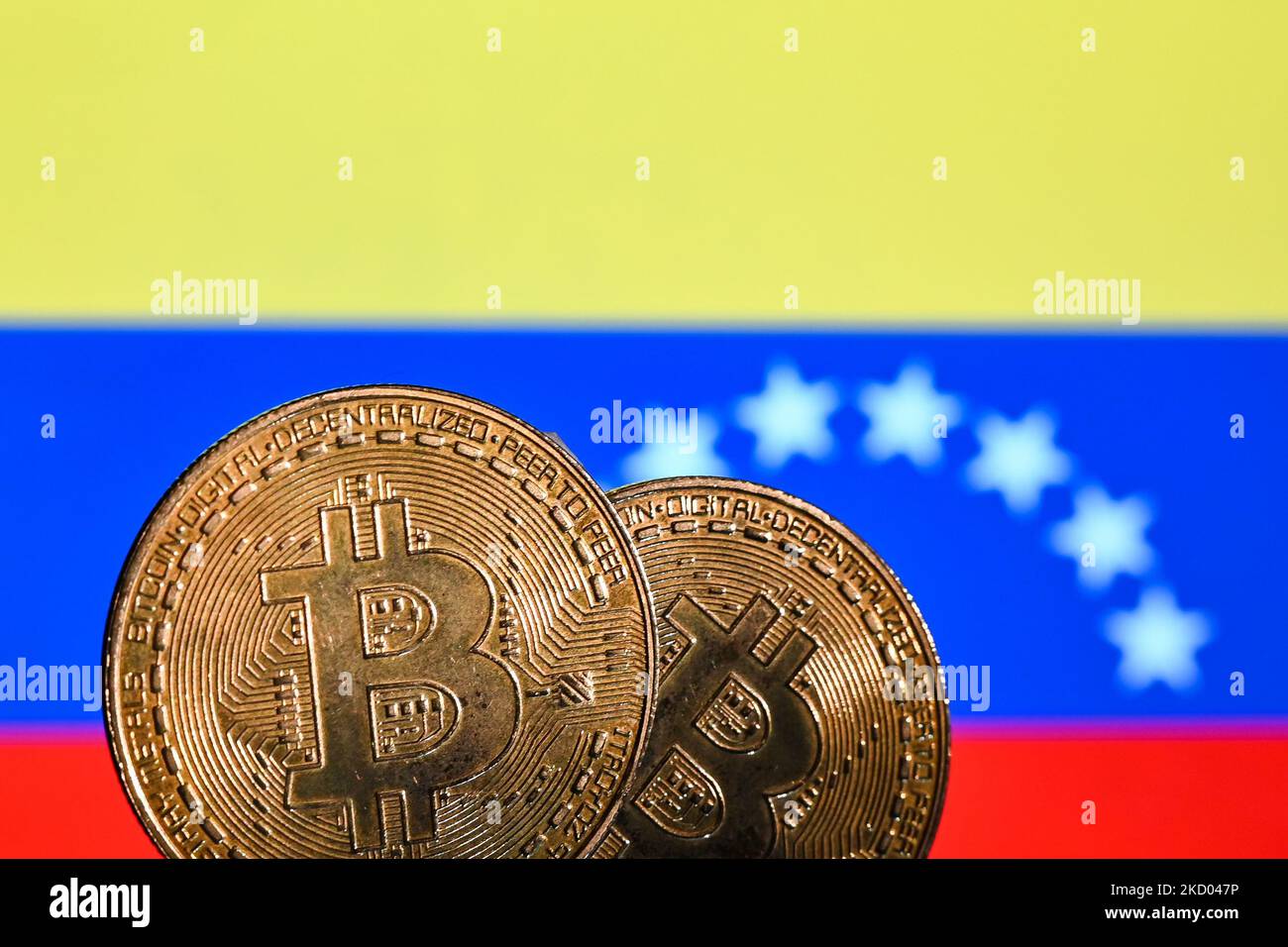 Illustrative image of two commemorative bitcoins seen in front of the ...