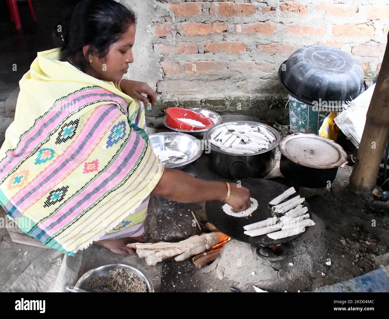An Assamese woman prepares 'pitha', a traditional sweet, ahead of ...