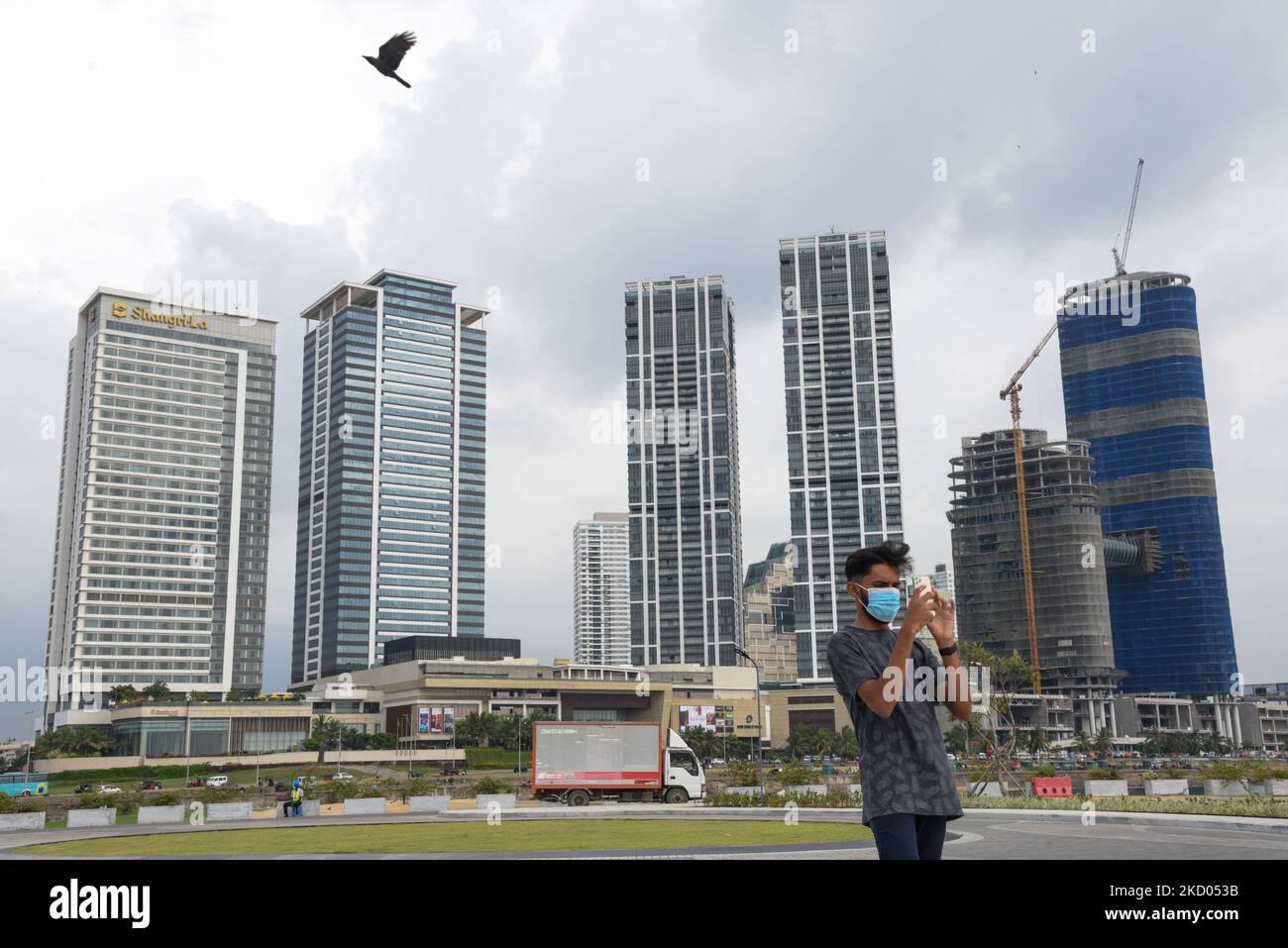 A man takes a picture of Colombo Port City Marina Promenade, Public ...